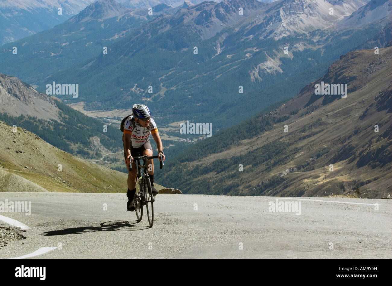 A cyclist finishing the last few metres of the climb to the Col du ...