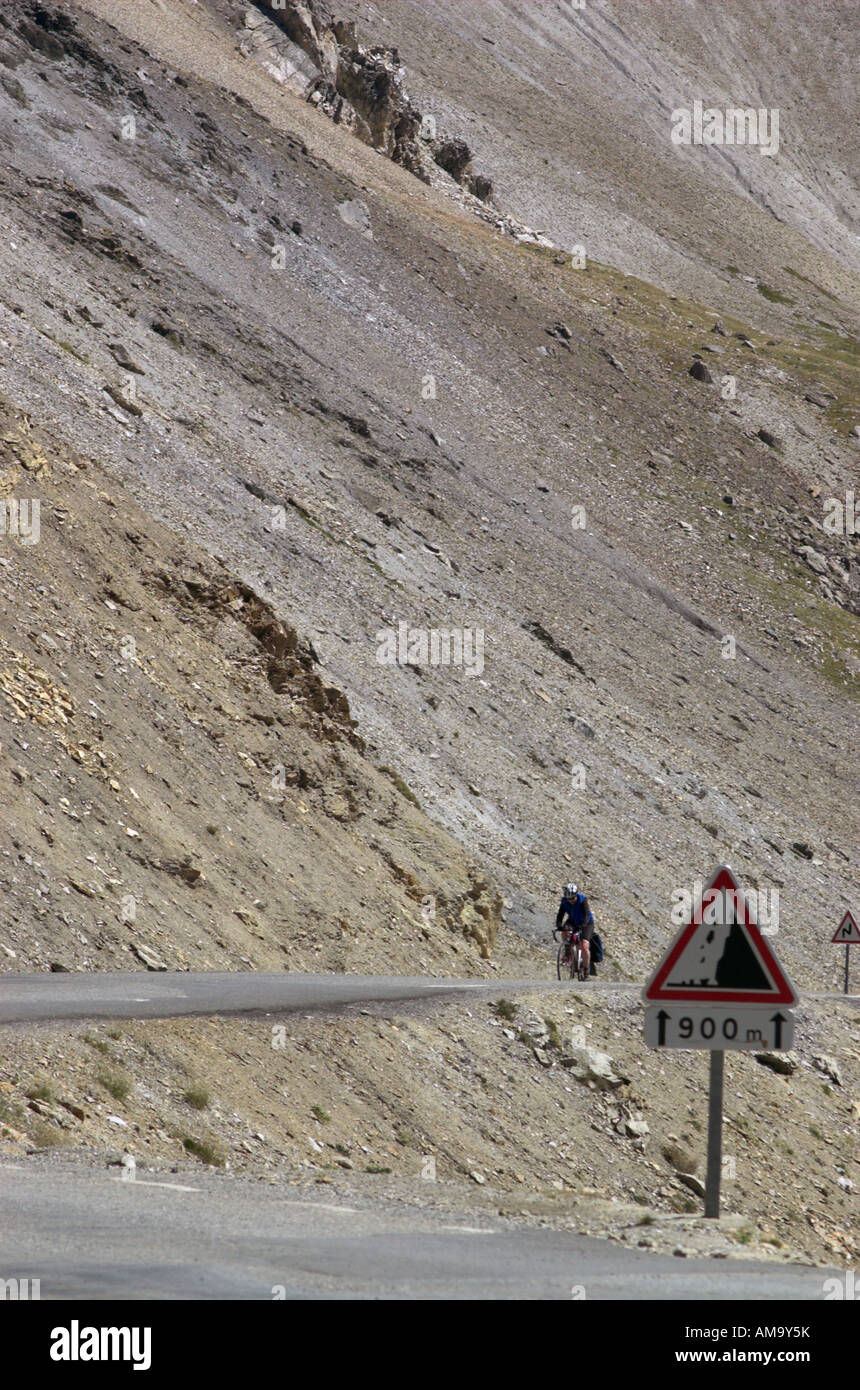 A cyclist finishing the last few metres of the climb to the Col du ...