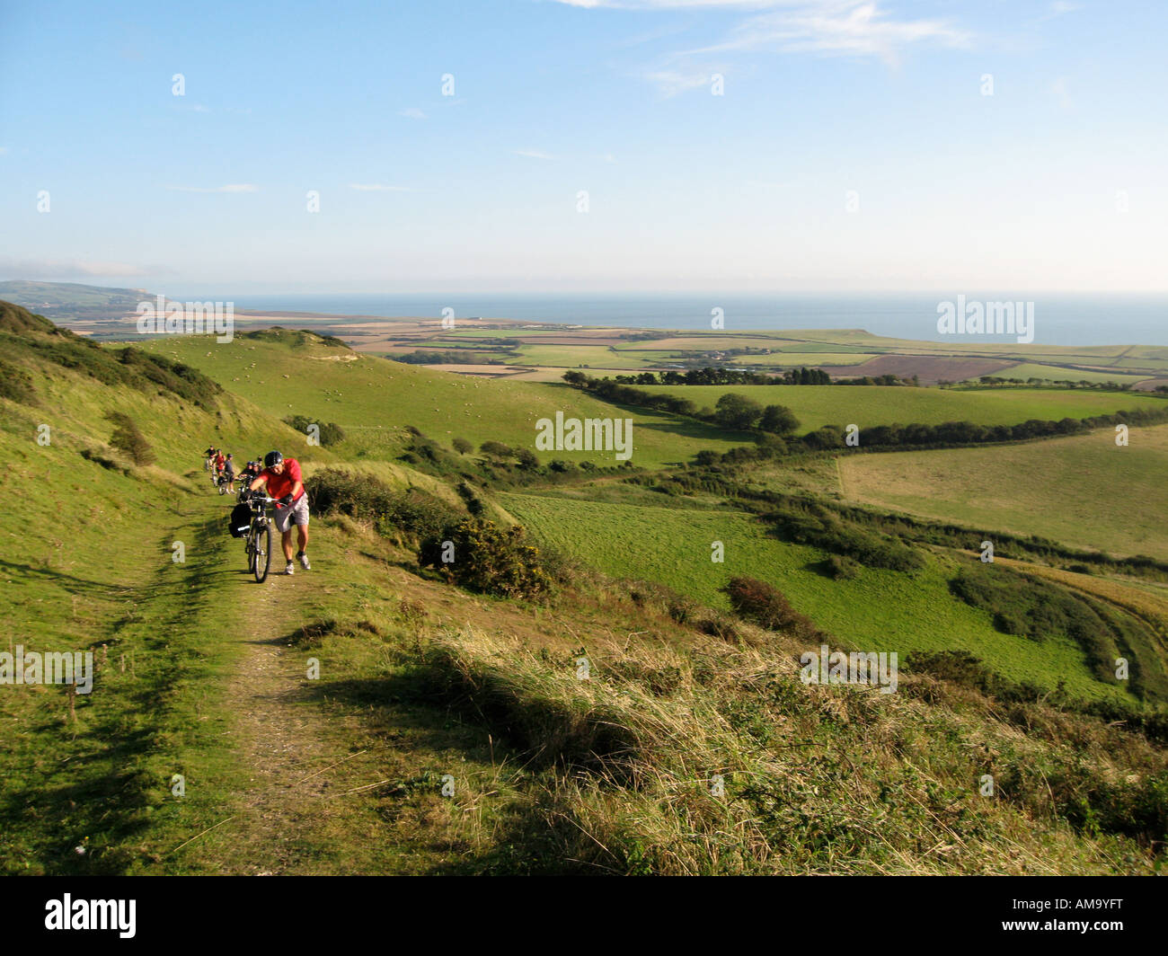 Pushing Bike Uphill Stock Photo - Alamy