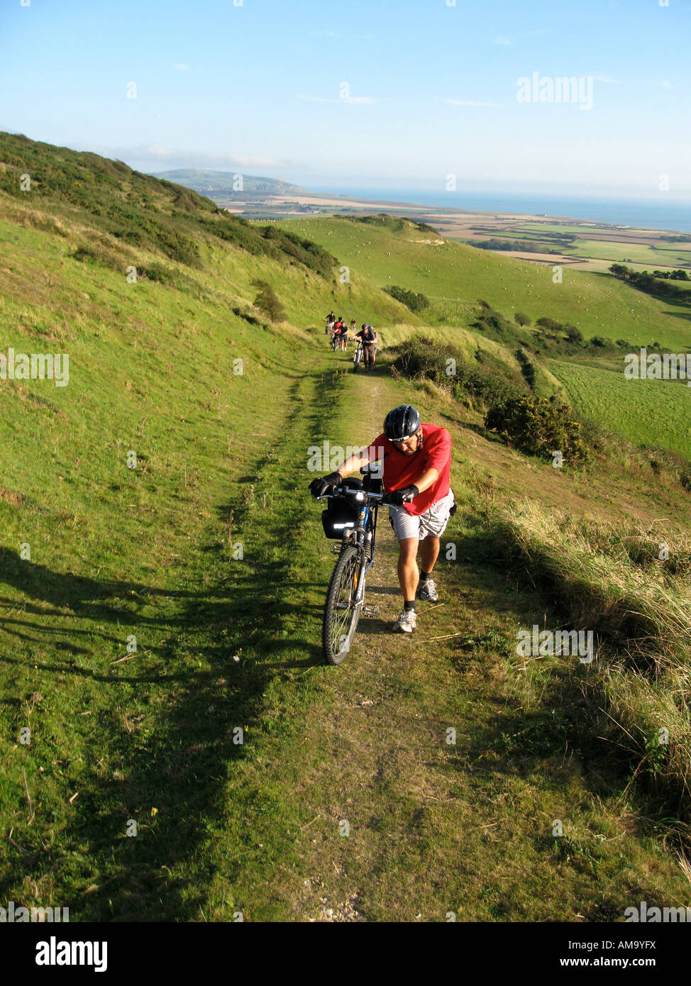 Pushing Bike Uphill Stock Photo - Alamy