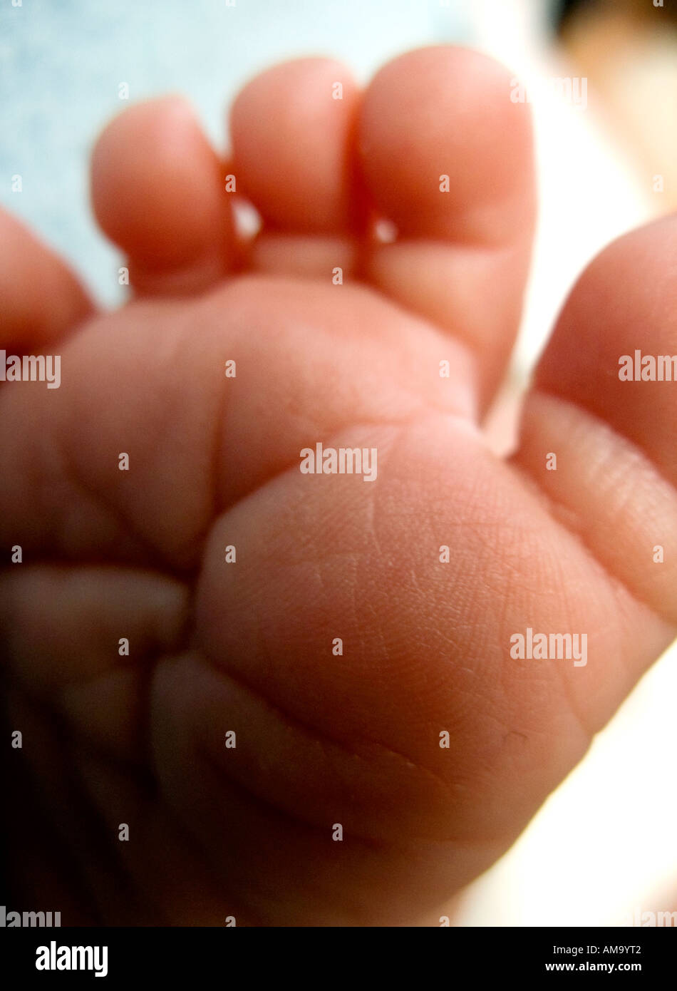 Legs of one week old girl Stock Photo - Alamy