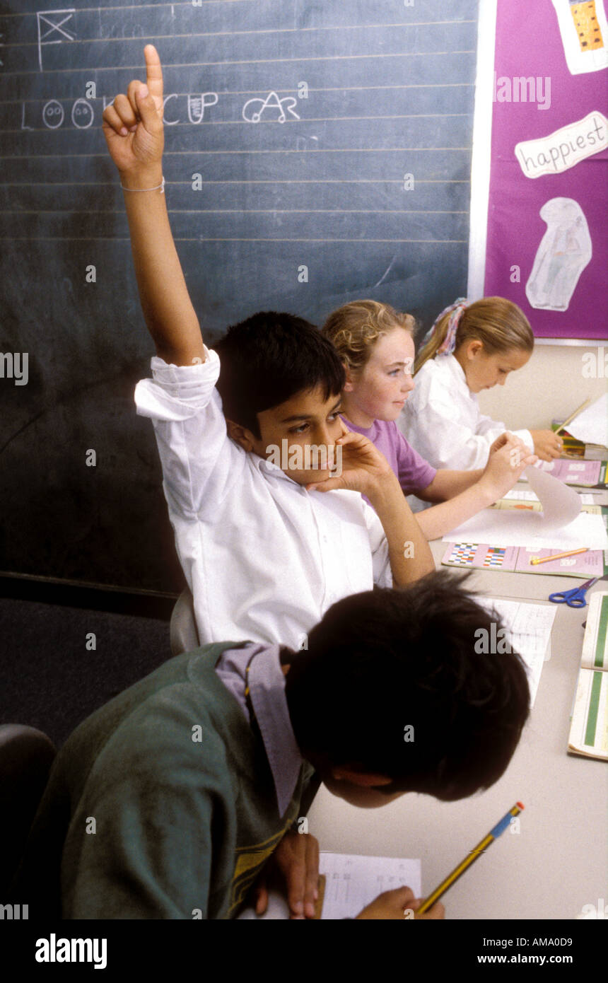 Children hands up in a classroom uk hi-res stock photography and images ...