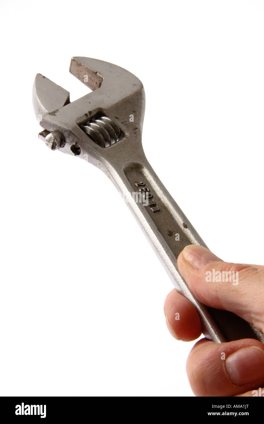 Hand holding an adjustable spanner Stock Photo - Alamy