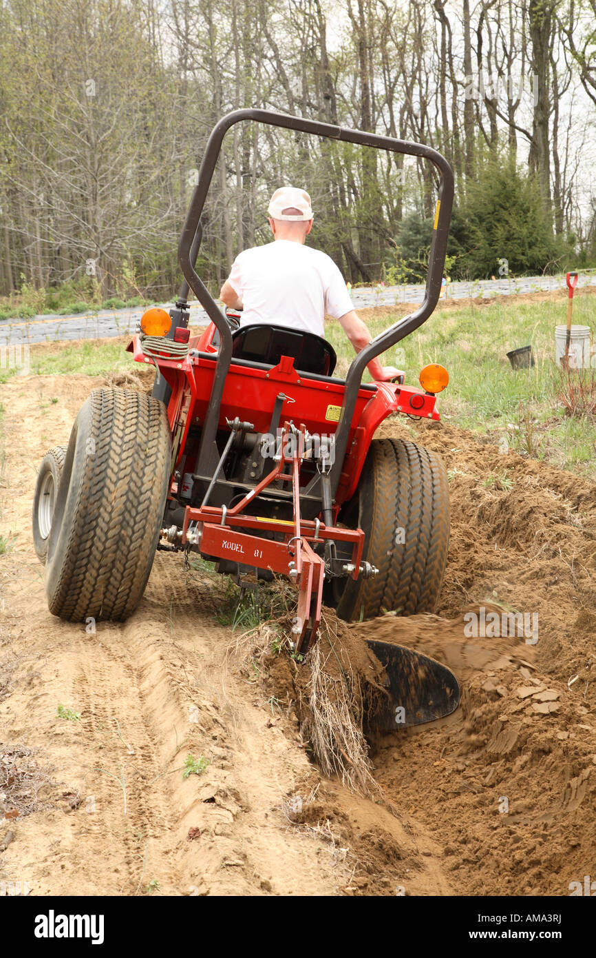 Man on plow preparing field hi-res stock photography and images - Alamy