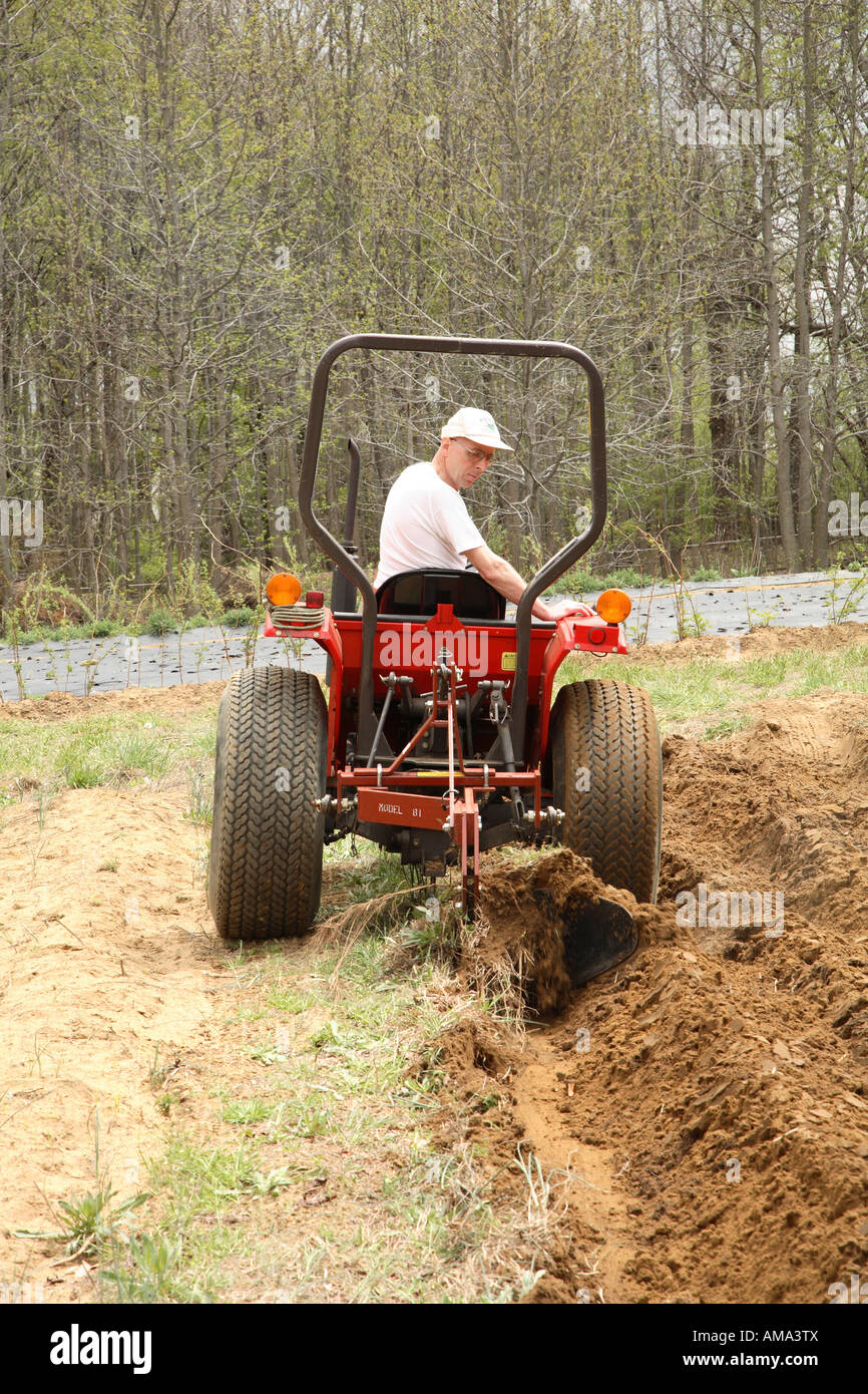 Man on plow preparing field hi-res stock photography and images - Alamy