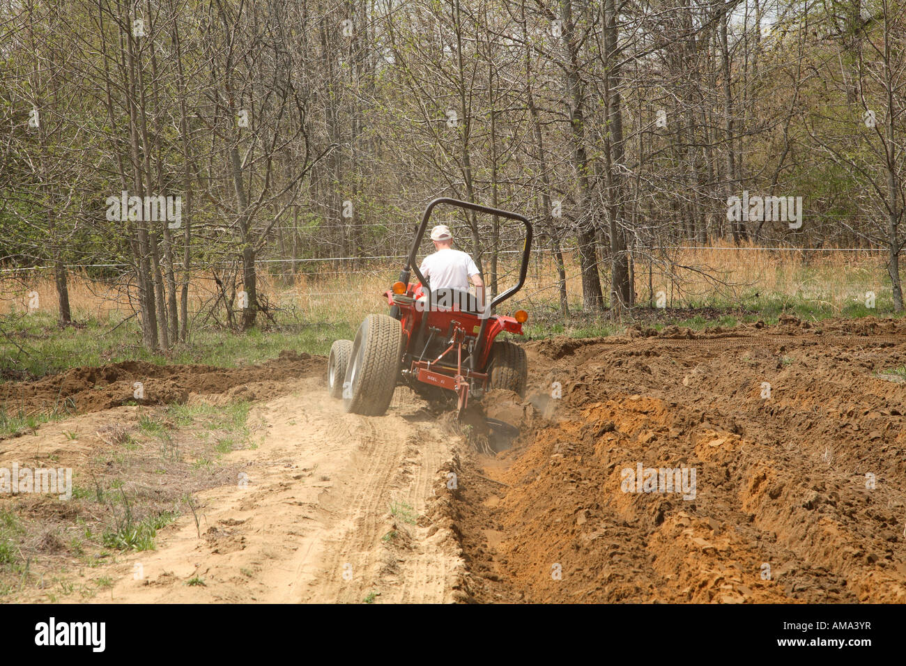 Man on plow preparing field hi-res stock photography and images - Alamy