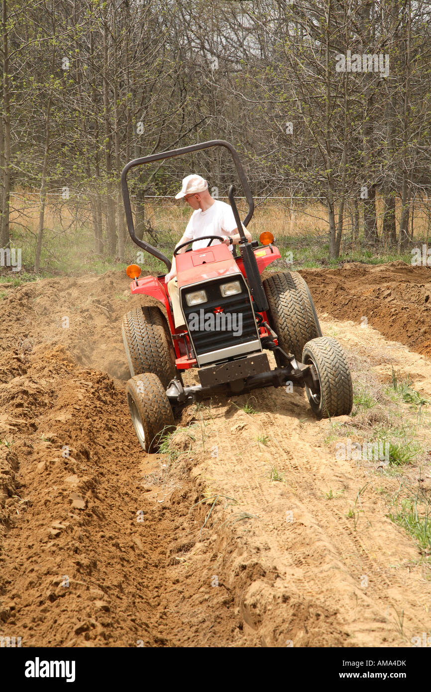 Man tractor ploughing hi-res stock photography and images - Alamy