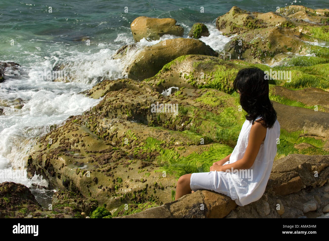 woman sitting on rocky shore Stock Photo - Alamy woman sitting on rocky shore Stock Photo - Alamy