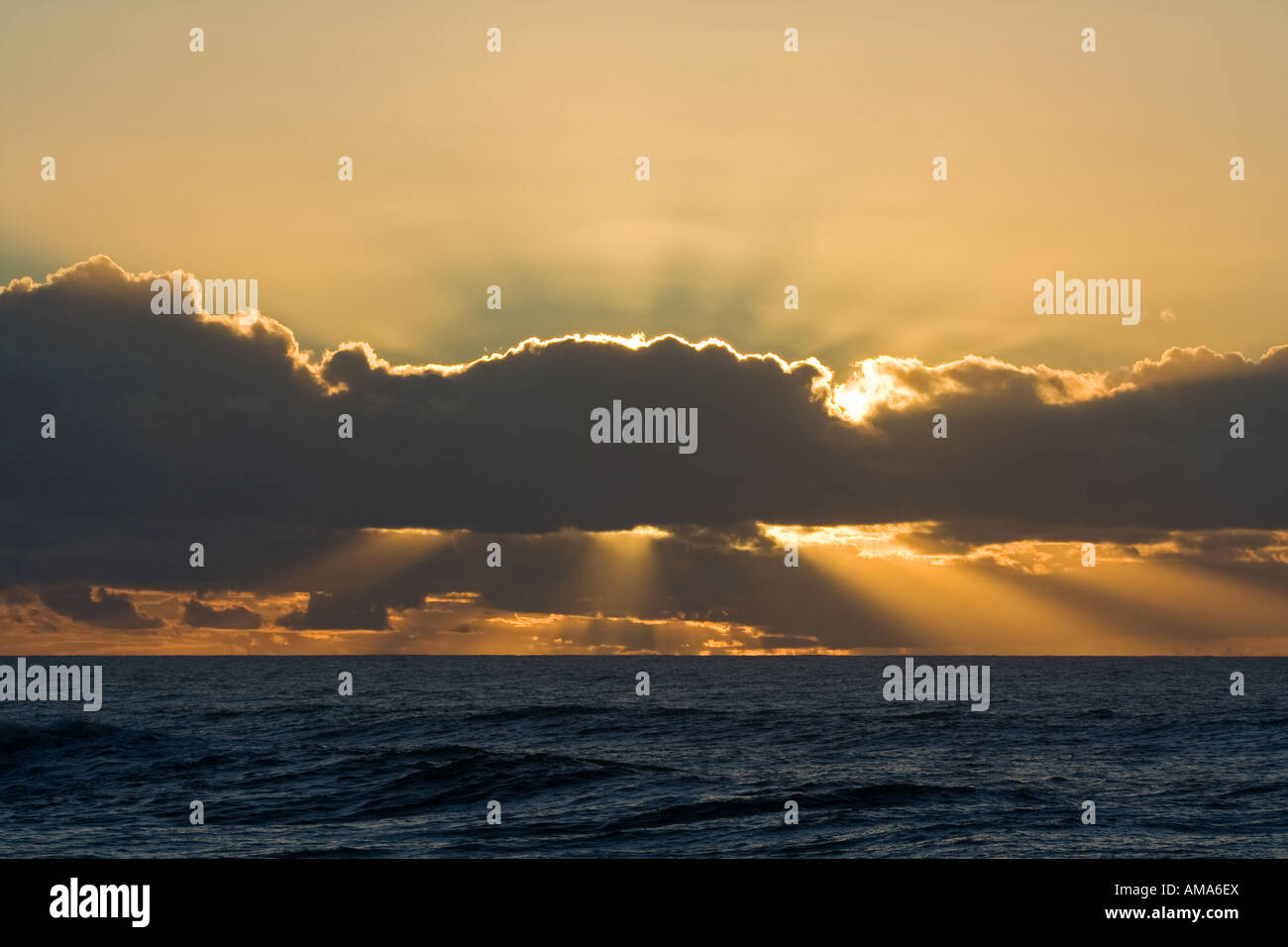 Sun rays bursting through clouds over the Pacific Ocean in Pescadero ...