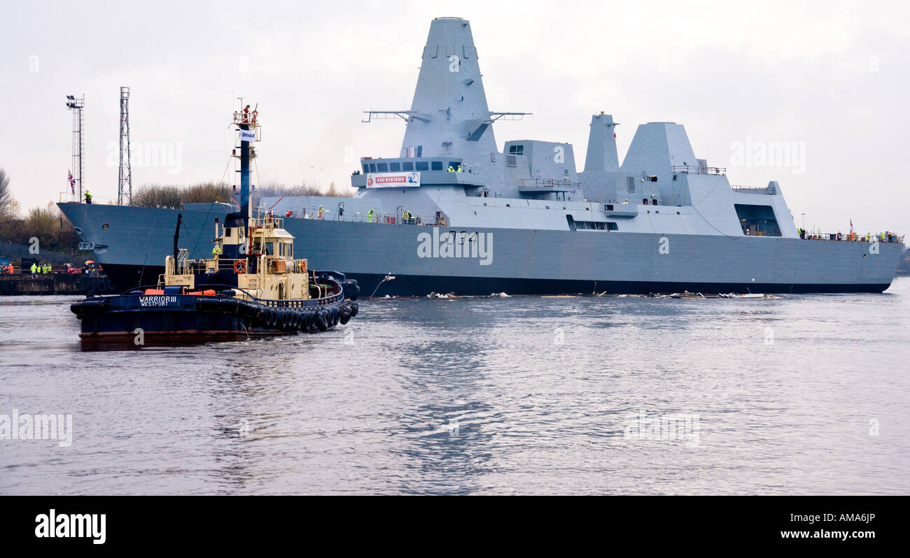 HMS Diamond on the Clyde after launch with tugboat Stock Photo - Alamy