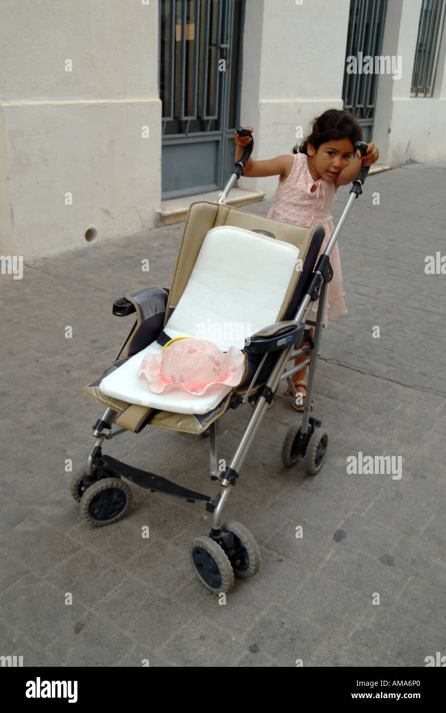 SPAIN GIRL PUSHING PRAM IN NIJAR, ALMERIA Photo © Julio Etchart Stock ...