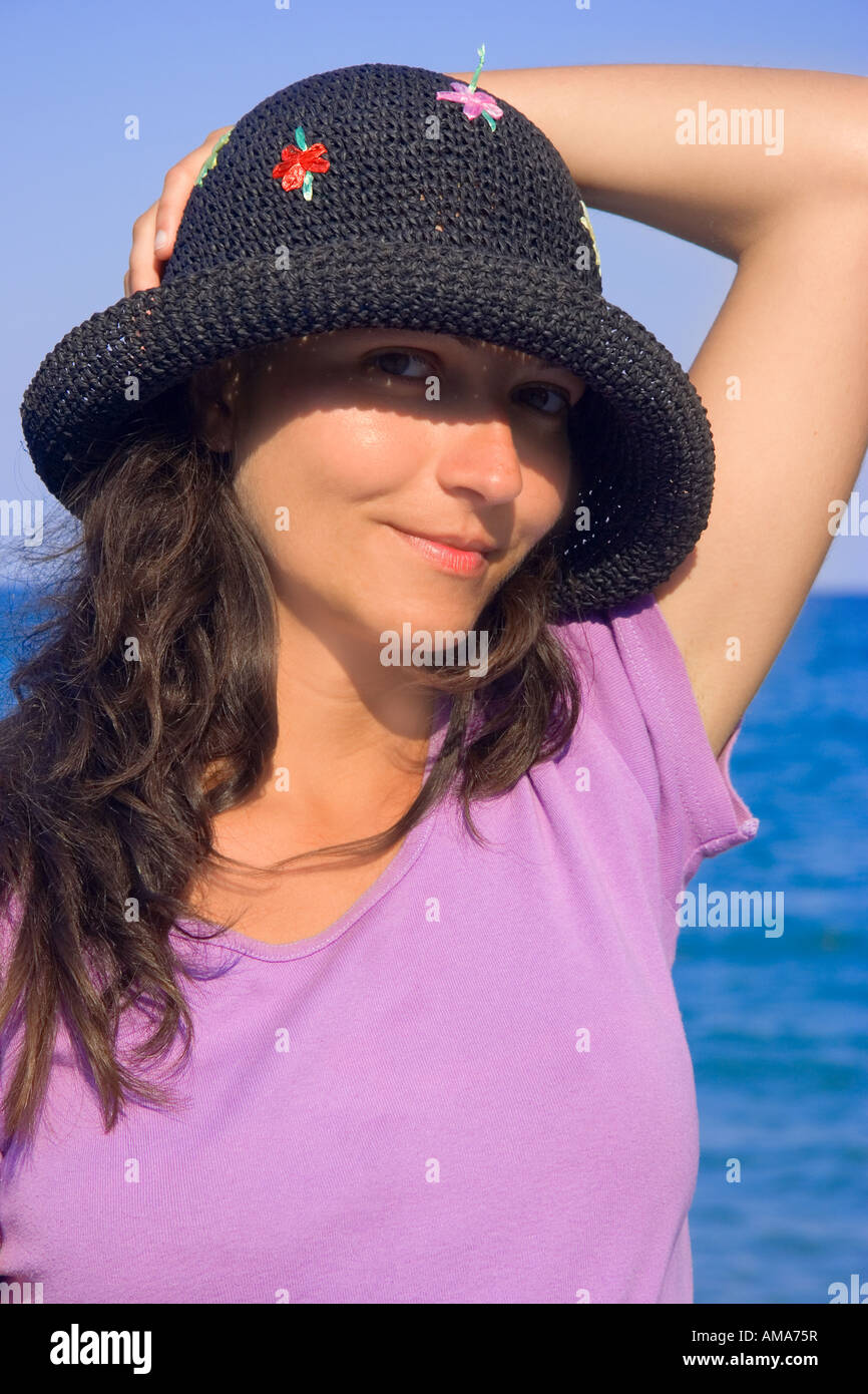 Beautiful female with hat posing Stock Photo - Alamy