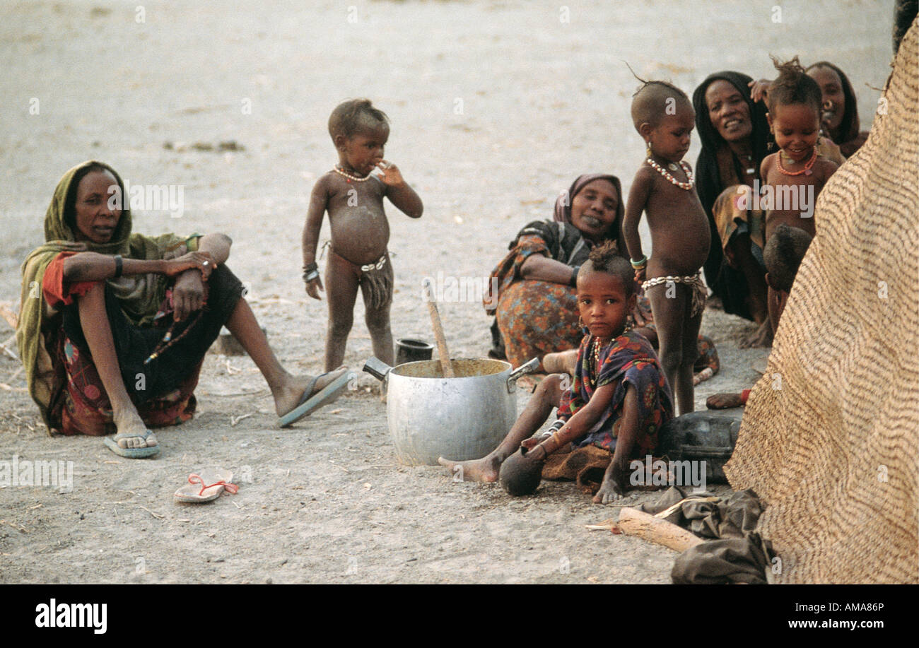 Family group relaxing outside their desert home in eastern Niger Africa ...
