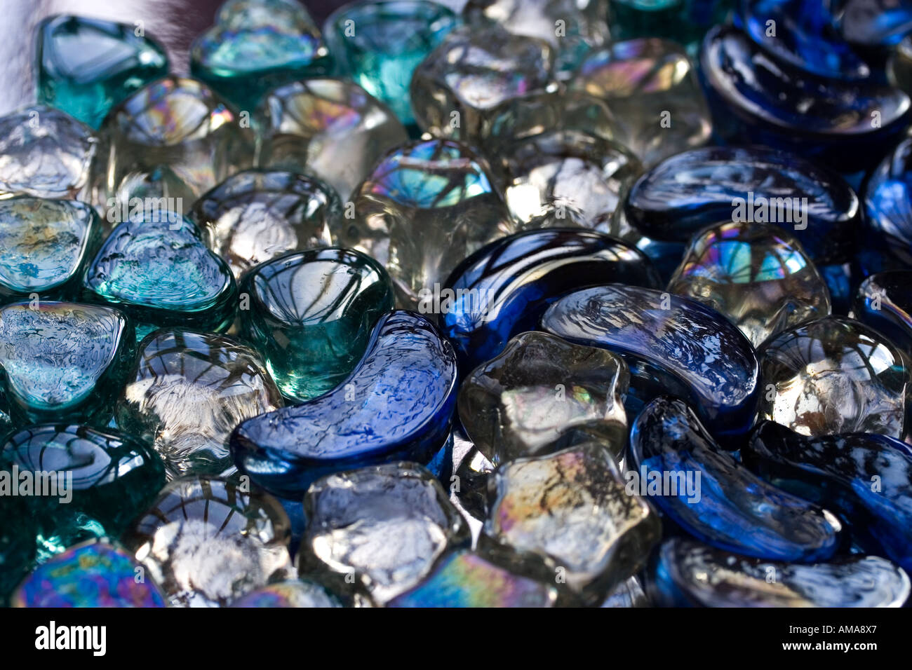 Multicoloured glass shapes on a reflective background (3 Stock Photo ...