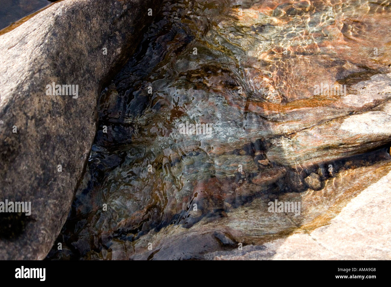 Clear rippling water in a rock pool Stock Photo - Alamy
