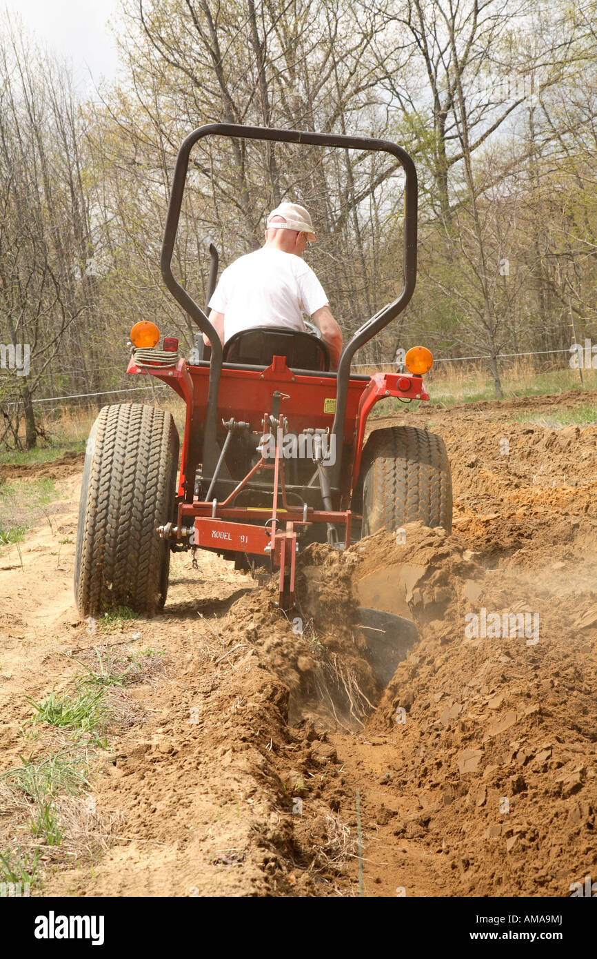 Man on plow preparing field hi-res stock photography and images - Alamy