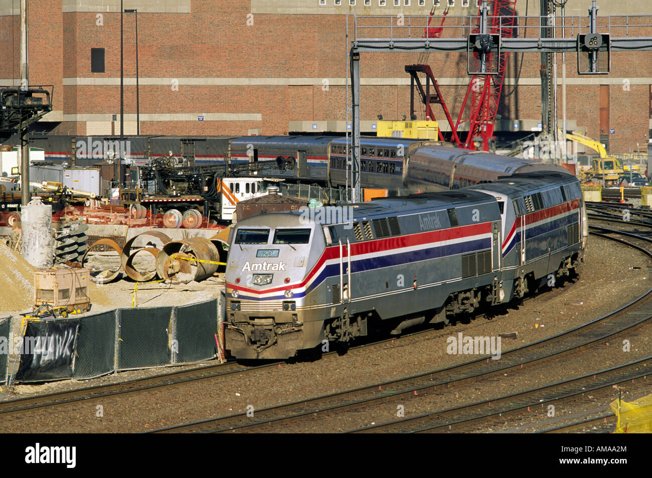 An Amtrak passenger train leaves South Station in Boston Stock Photo ...