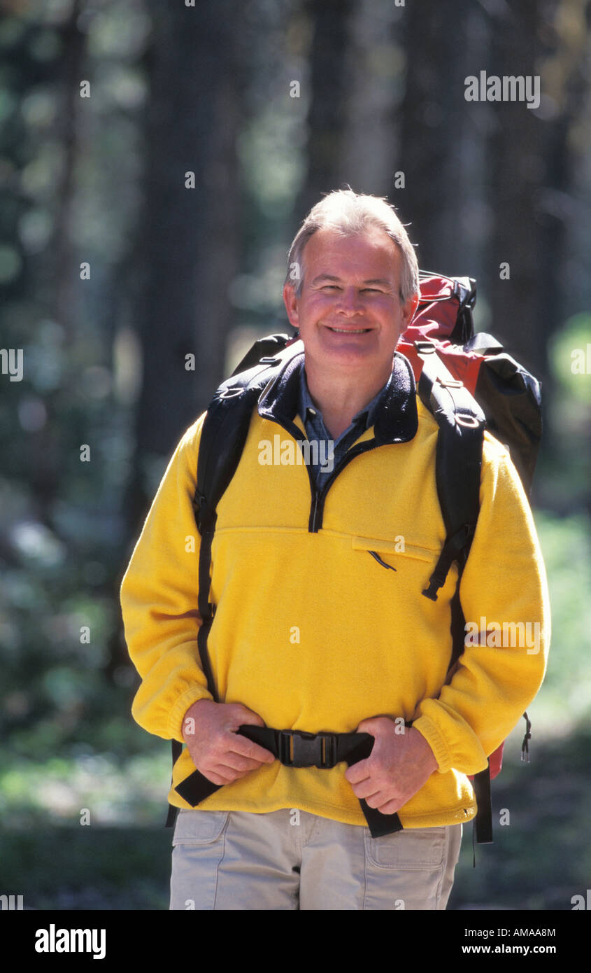 Man Walking with Backpack Stock Photo - Alamy