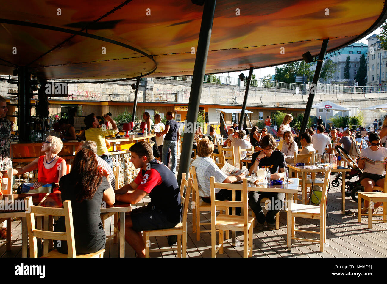 Aug 2008 - People at the beach bar Herrmann by the danube riverside ...