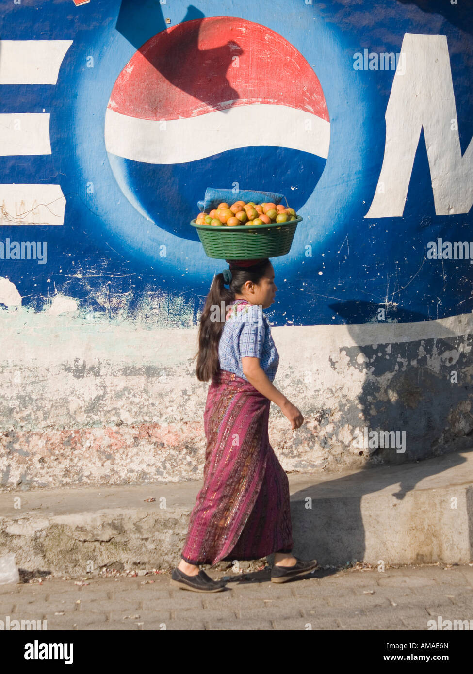 Santiago Atitlan, Guatemala: Logos and traditional dress contrast in ...
