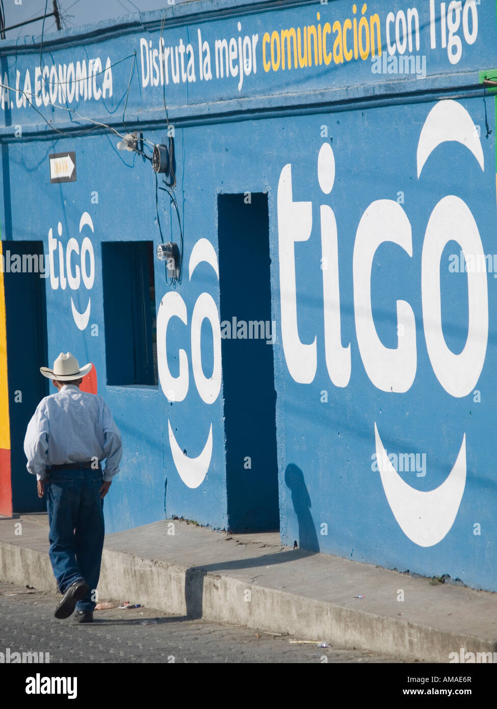 Santiago Atitlan, Guatemala: Logos and traditional dress contrast in ...