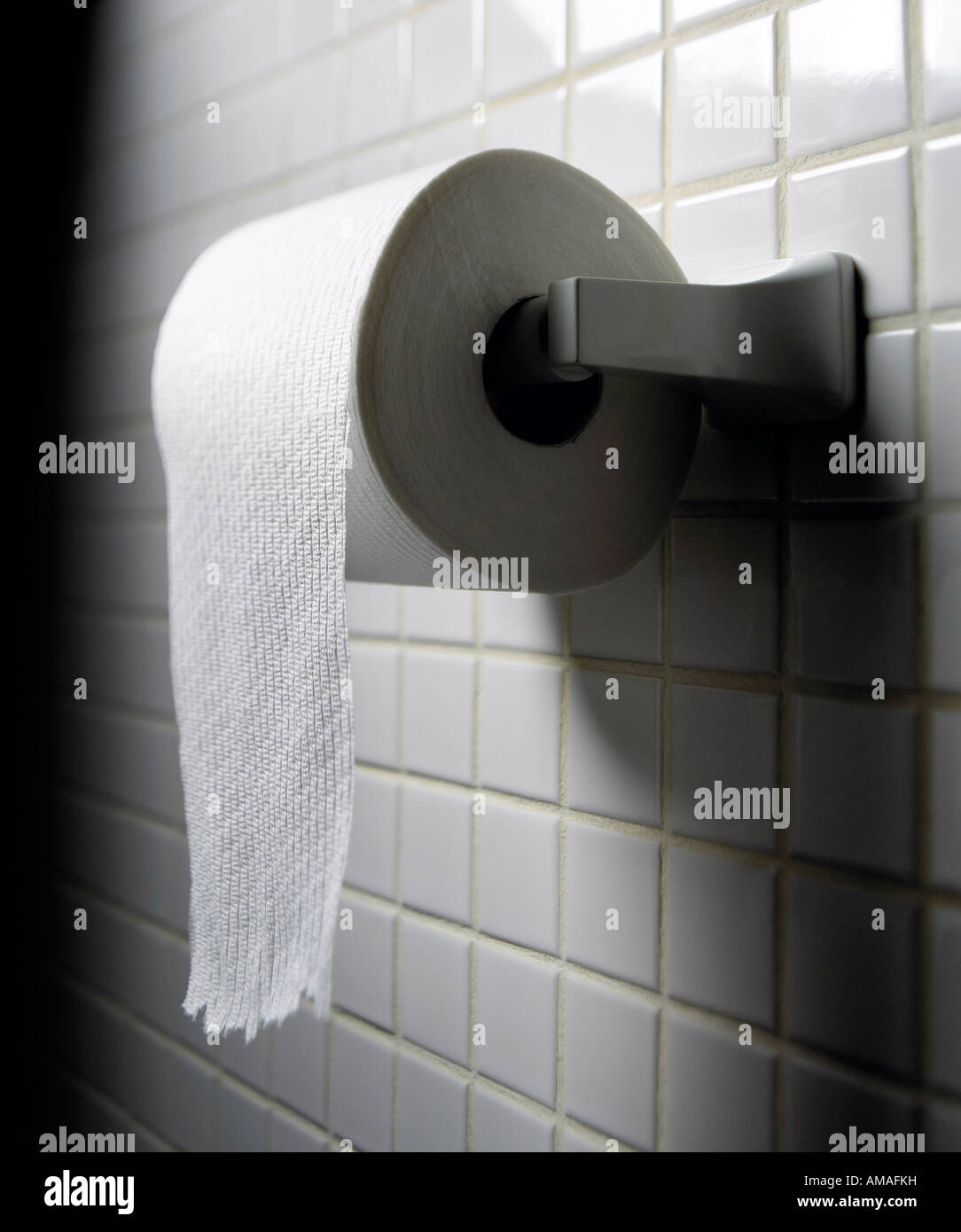 roll of toilet paper hanging on the wall Stock Photo - Alamy