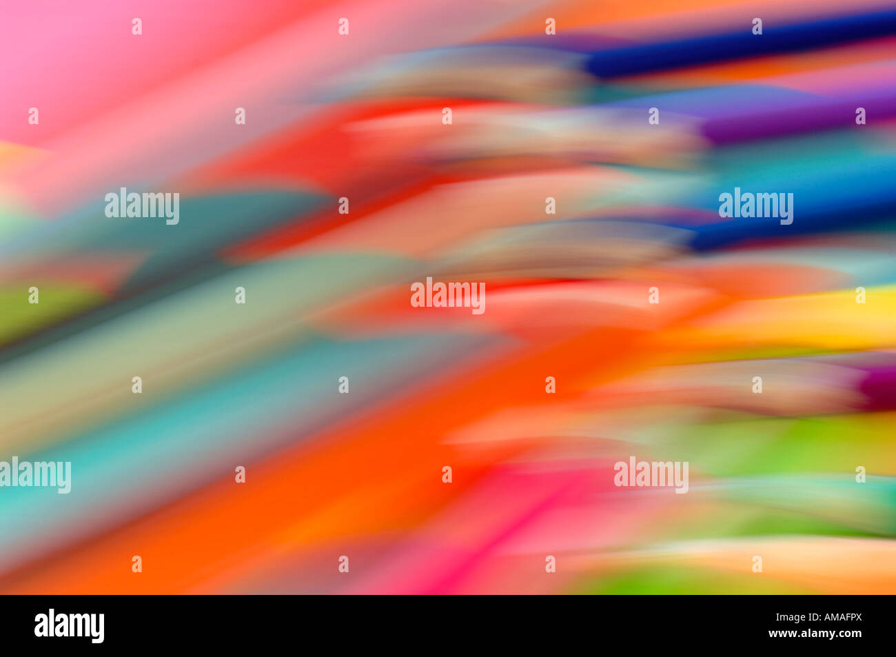 brightly coloured pencil crayons shot with an abstract movement concept ...