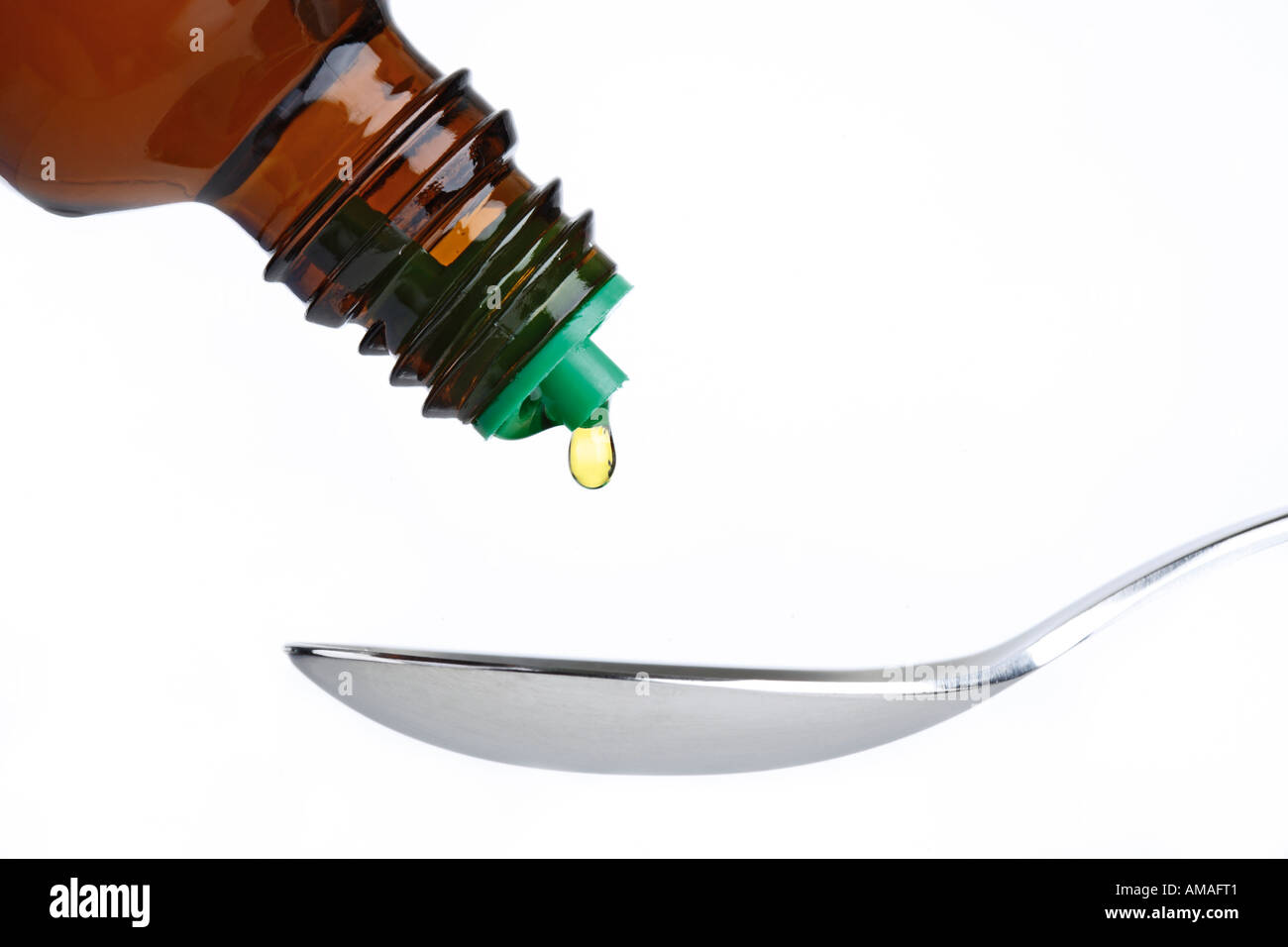 Drop pouring into spoon, close-up Stock Photo - Alamy