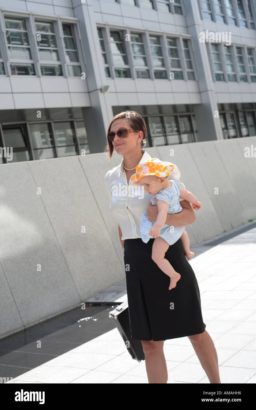 mother with baby going to work Stock Photo - Alamy