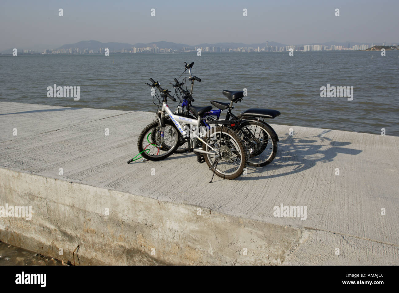 Two bicycle at the Deep Bay Stock Photo - Alamy