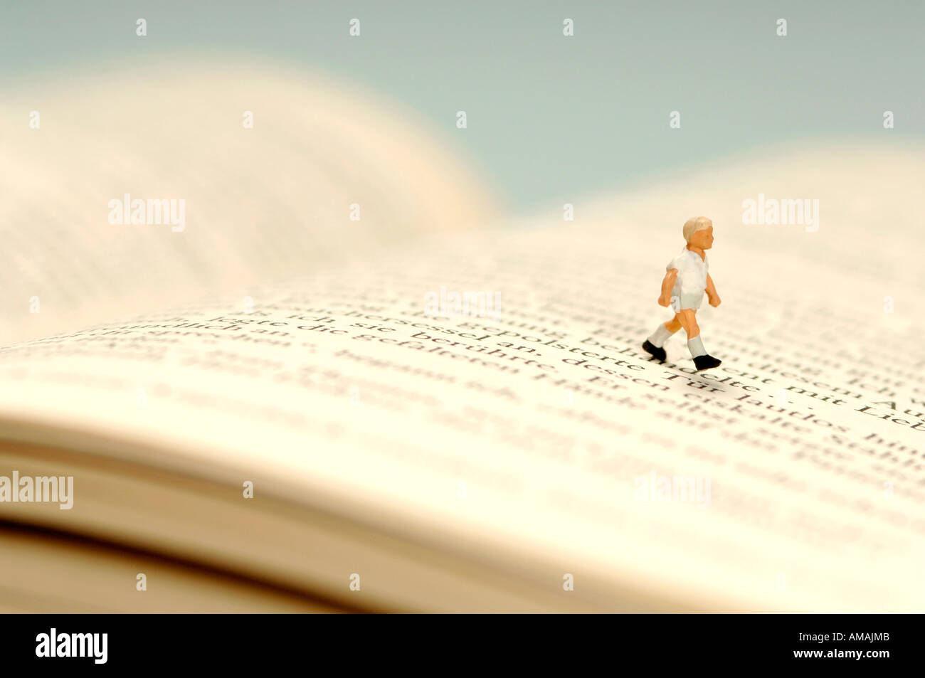 Child walking over book Stock Photo - Alamy