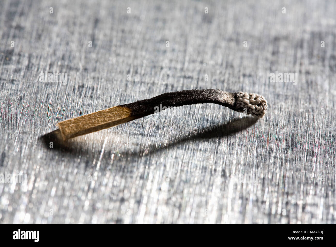 A burnt matchstick Stock Photo - Alamy