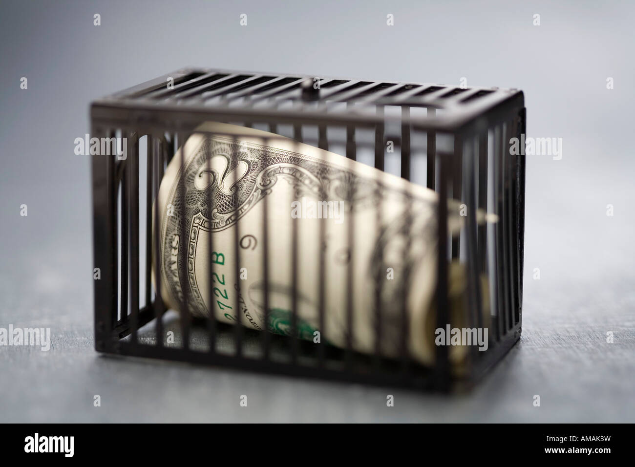 A banknote in a cage Stock Photo - Alamy