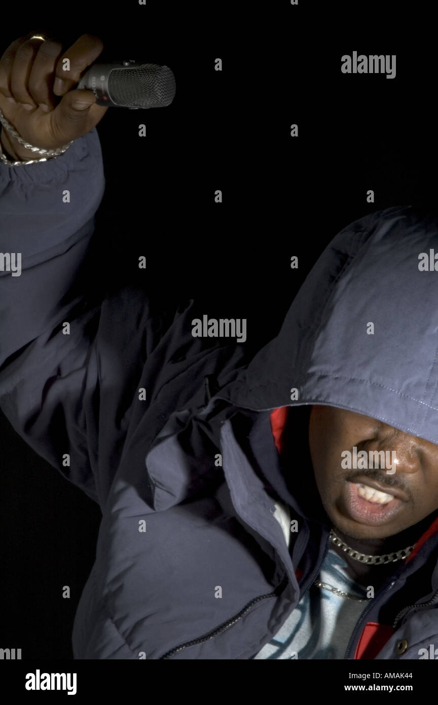 A young black male angry with not be heard with the mic Stock Photo - Alamy
