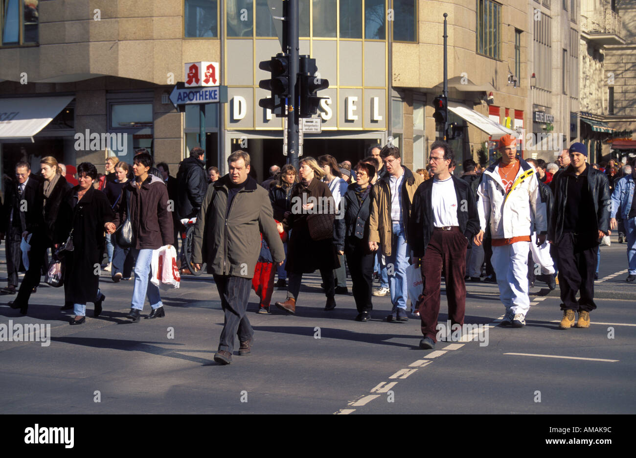 Germany Berlin crowds crossing the street at an intersection Stock ...