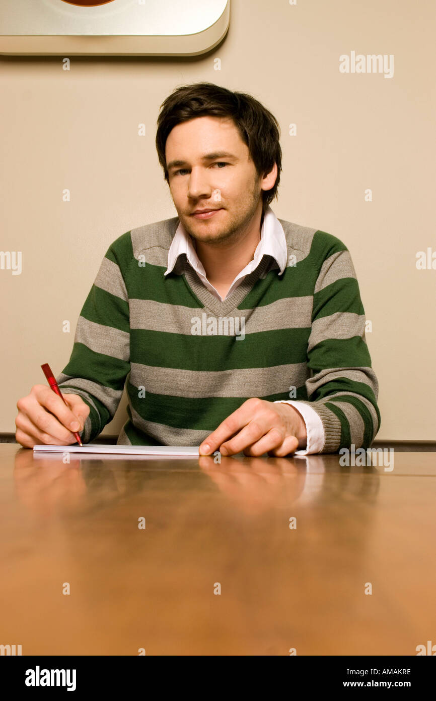 Young man writing letter Stock Photo - Alamy