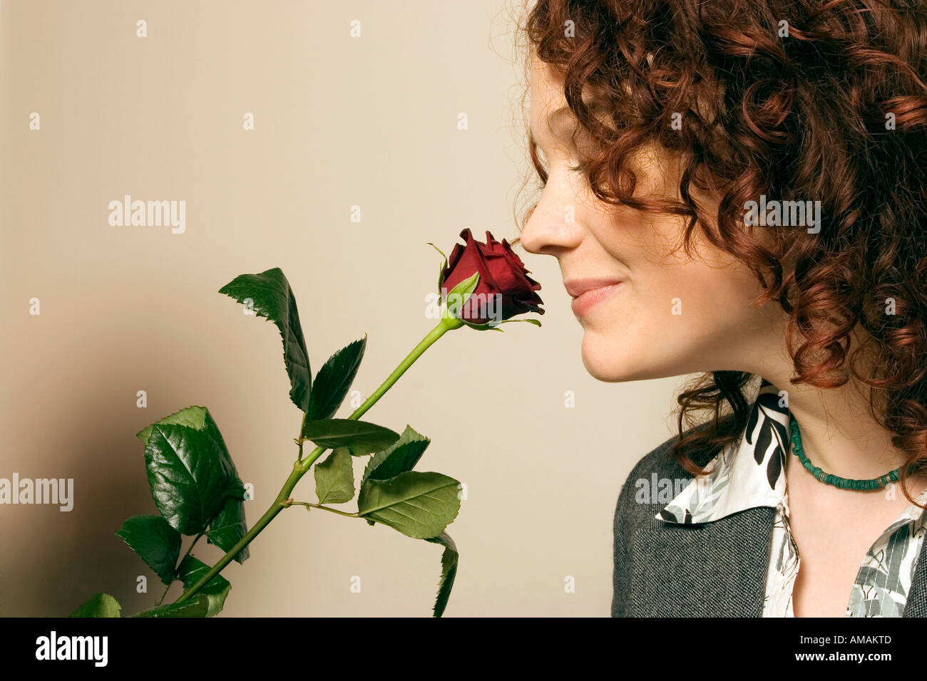 Woman smelling rose, side view Stock Photo - Alamy