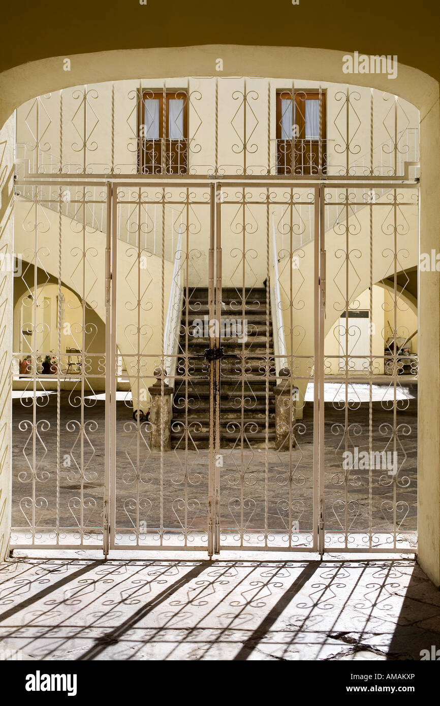 Sunlight shining through a gate Stock Photo - Alamy