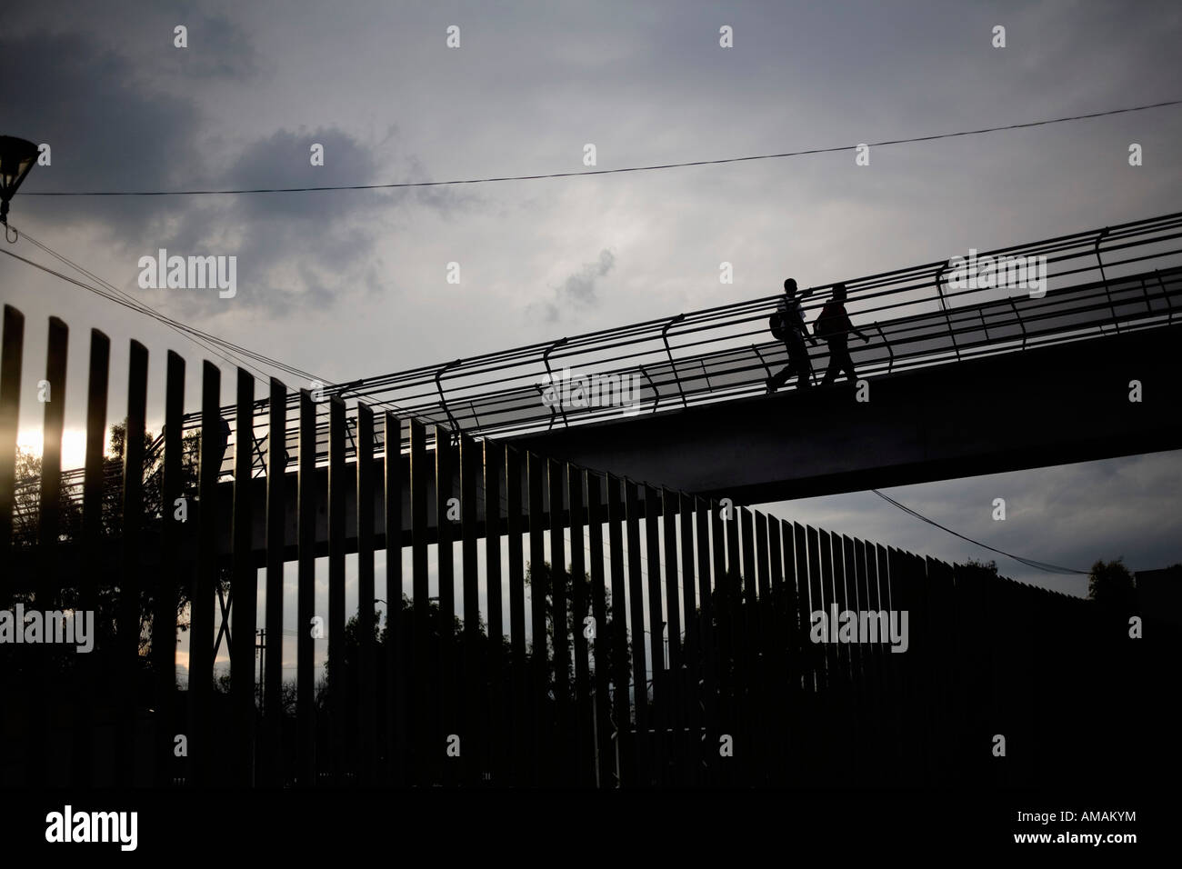 Silhouette two people walking bridge High Resolution Stock Photography ...