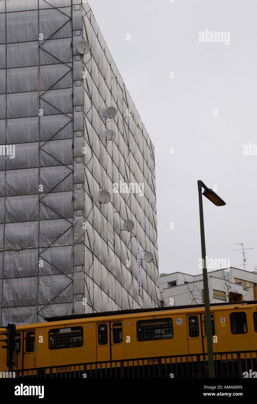 A train passing in front of a building Stock Photo - Alamy