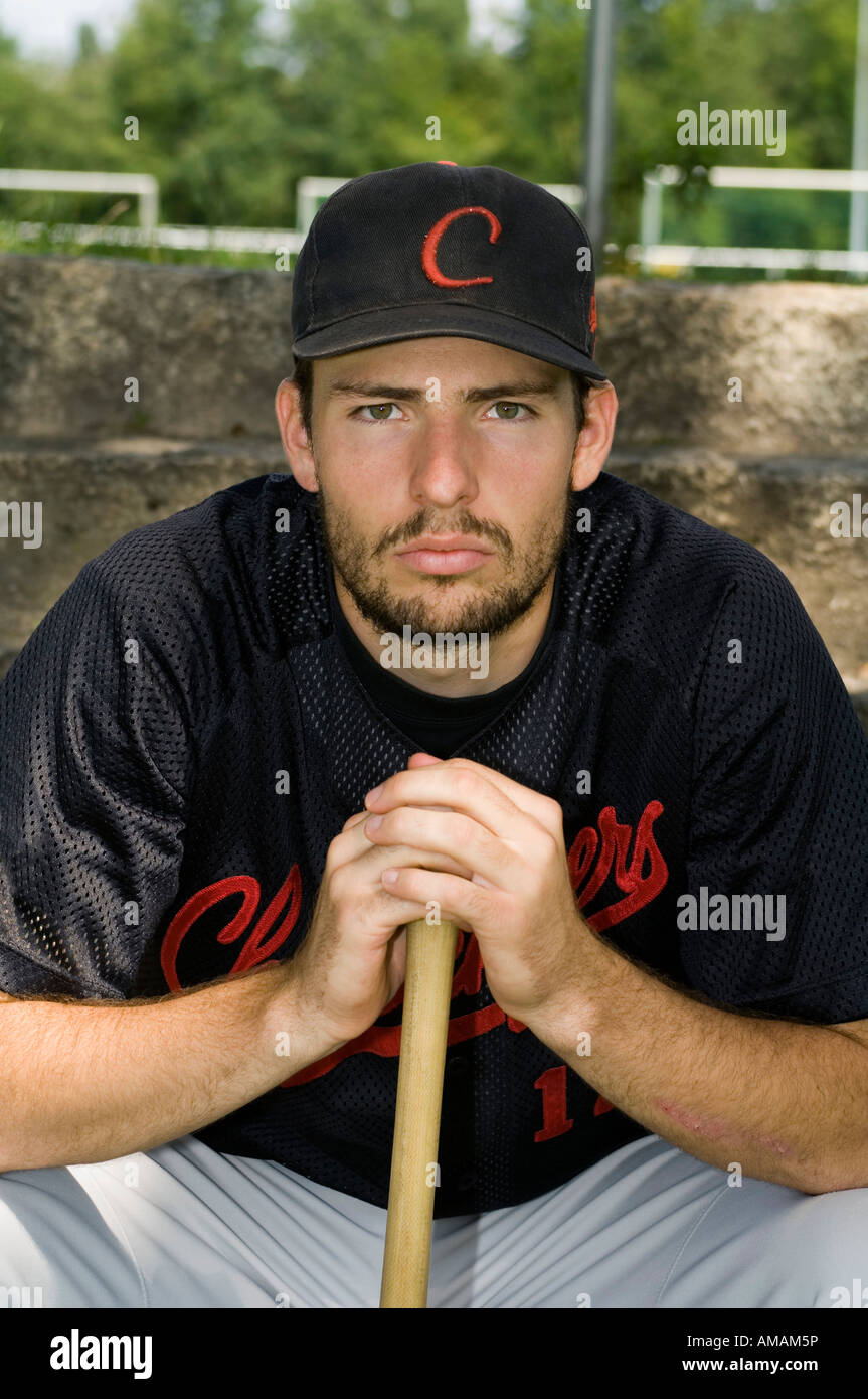 Portrait of a baseball player crouching with a baseball bat Stock Photo ...