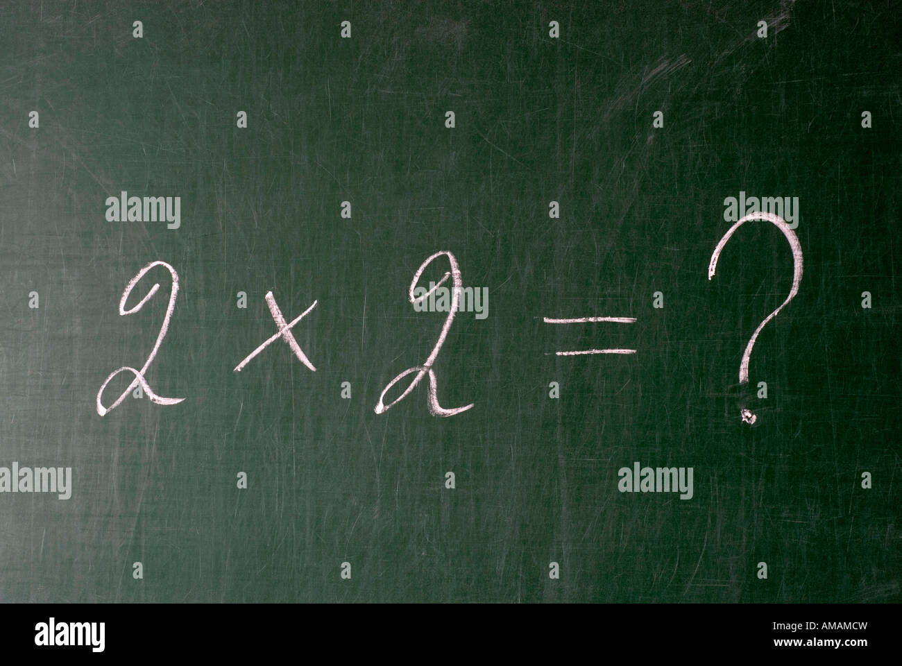 A multiplication problem on a chalkboard with a question mark Stock ...