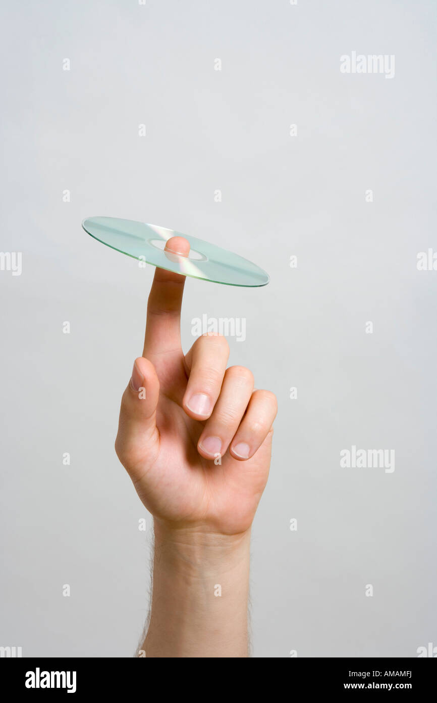 Detail of a man with a CD on his finger Stock Photo - Alamy