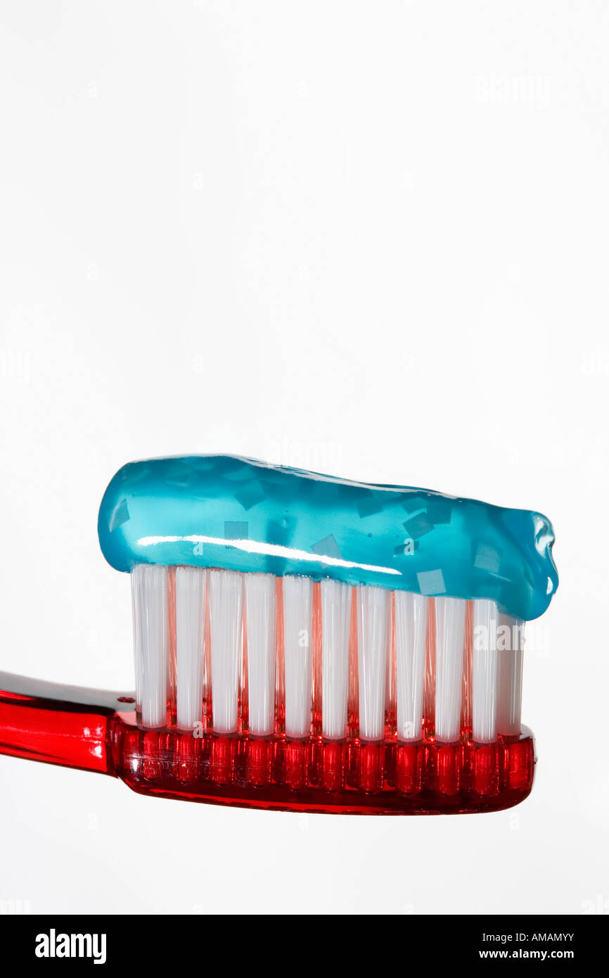 Toothbrush with blue toothpaste Stock Photo - Alamy