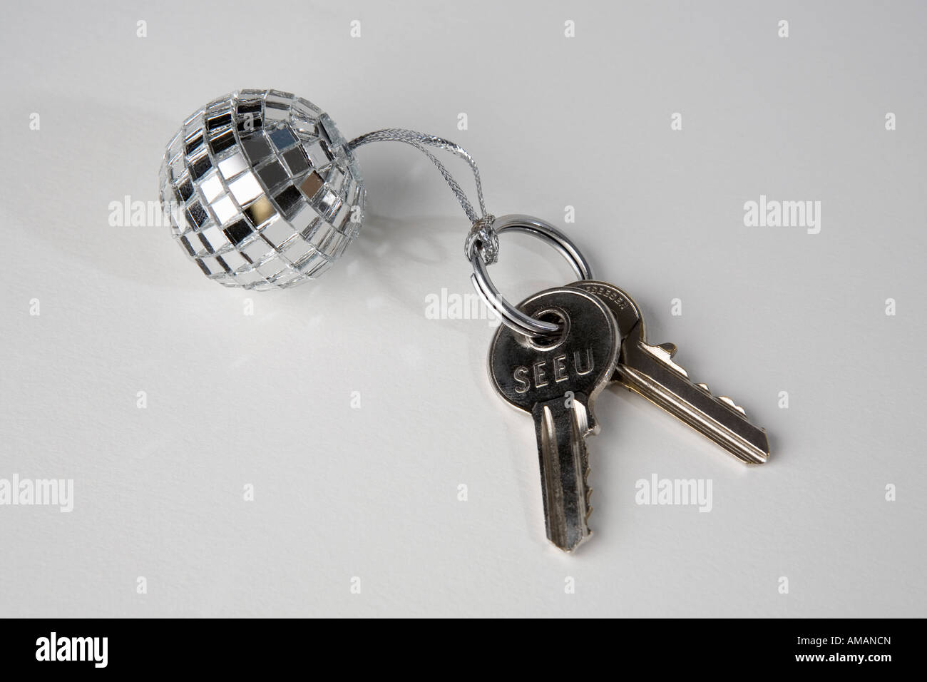 A disco ball key ring and keys Stock Photo - Alamy