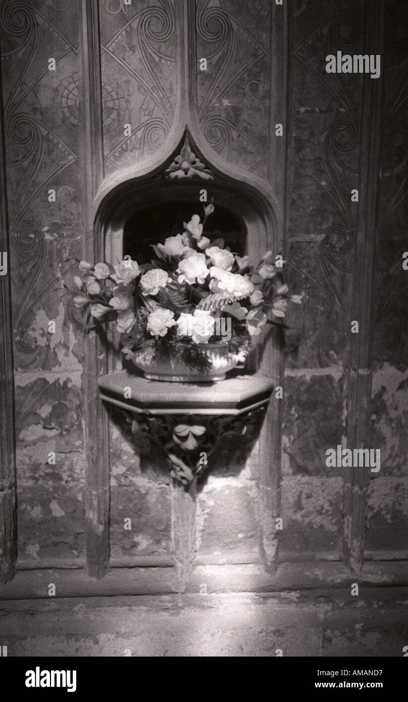 gothic niche in church wall in monochrome with flowers Stock Photo - Alamy