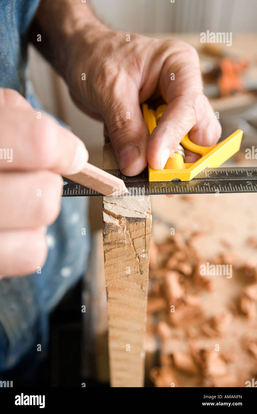 Detail of a carpenter measuring Stock Photo - Alamy