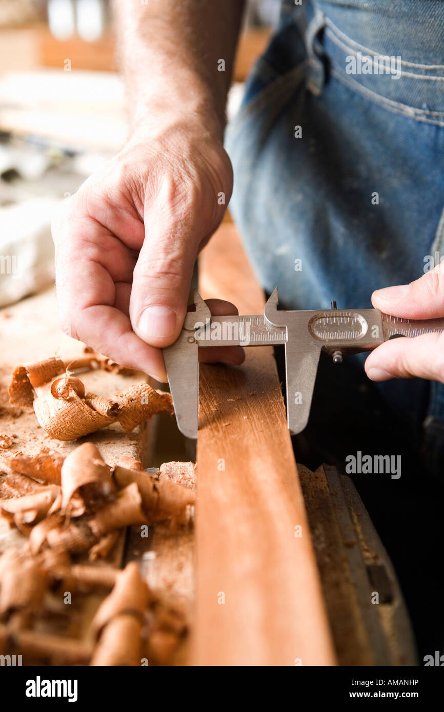 Detail of a carpenter measuring wood Stock Photo - Alamy