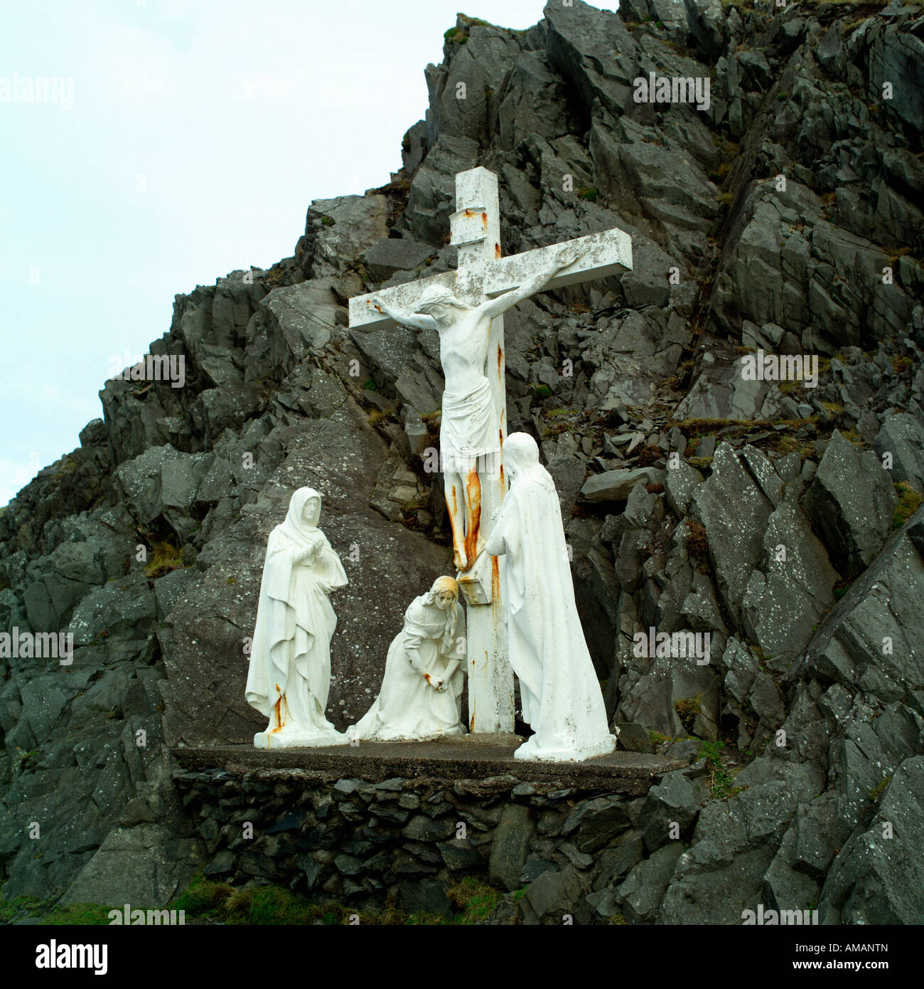 Stone crucifix and statues Stock Photo - Alamy