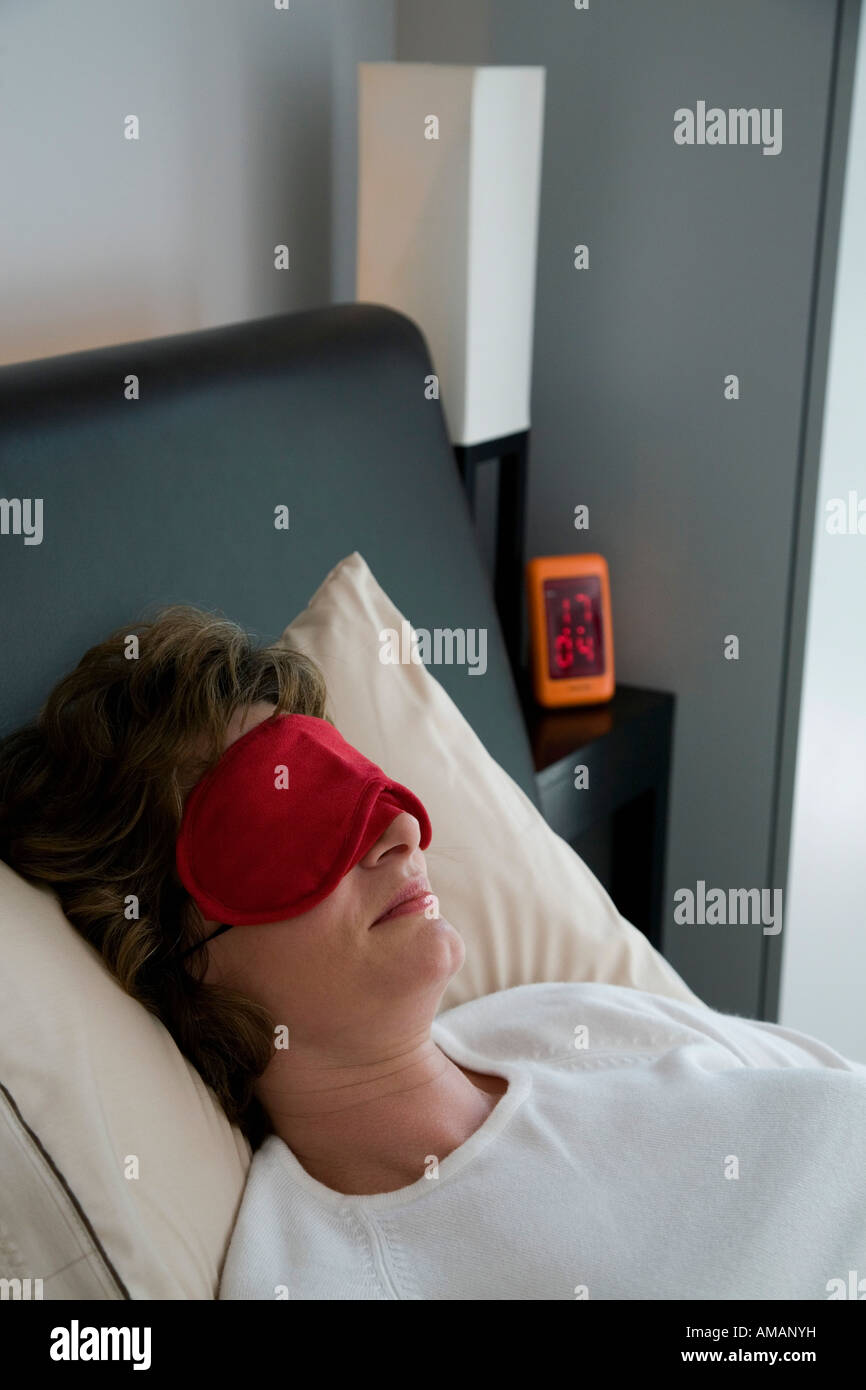 A woman wearing an sleep mask Stock Photo - Alamy
